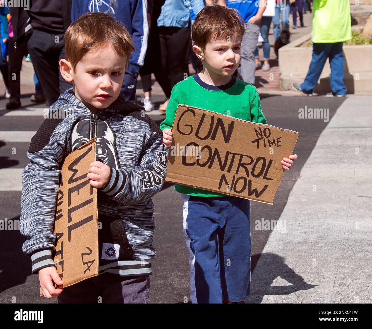 Four-year-old twins Eli, left, and his brother Nathan Hellman hold ...