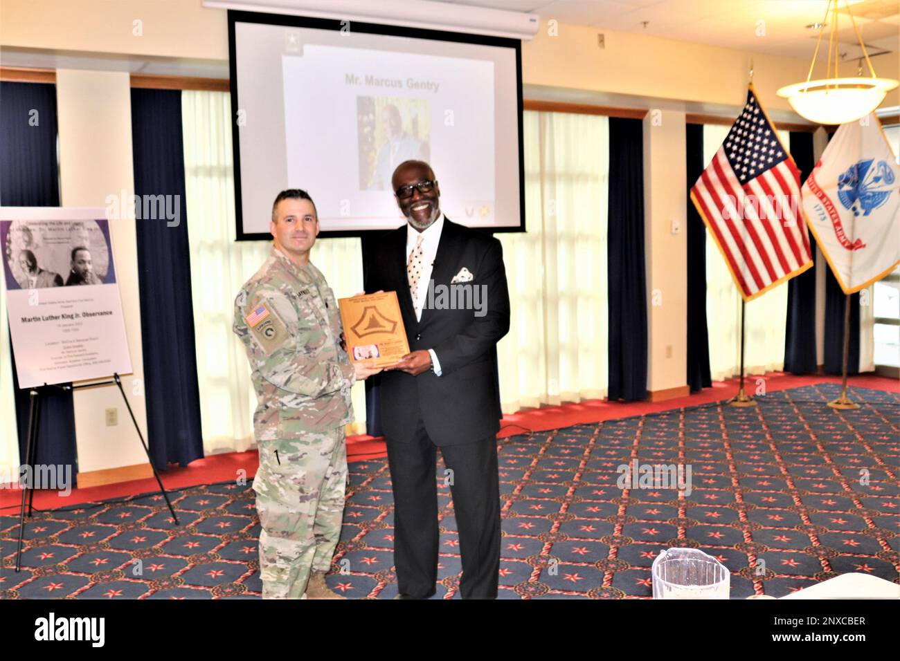 Guest speaker Marcus Gentry receives a special appreciation plaque from ...