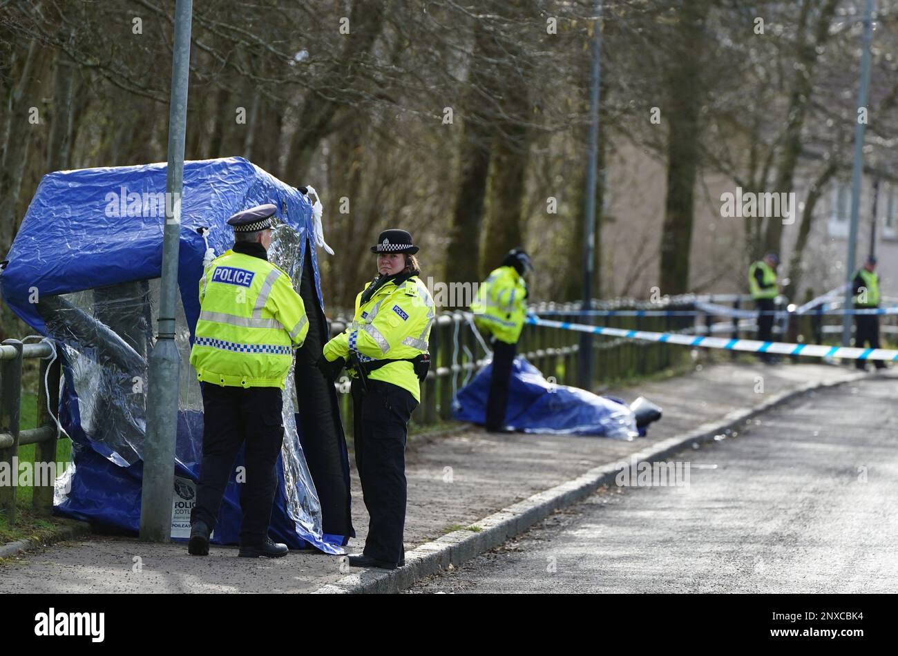 Police at the scene on Nairn Road in Greenock, as a murder ...