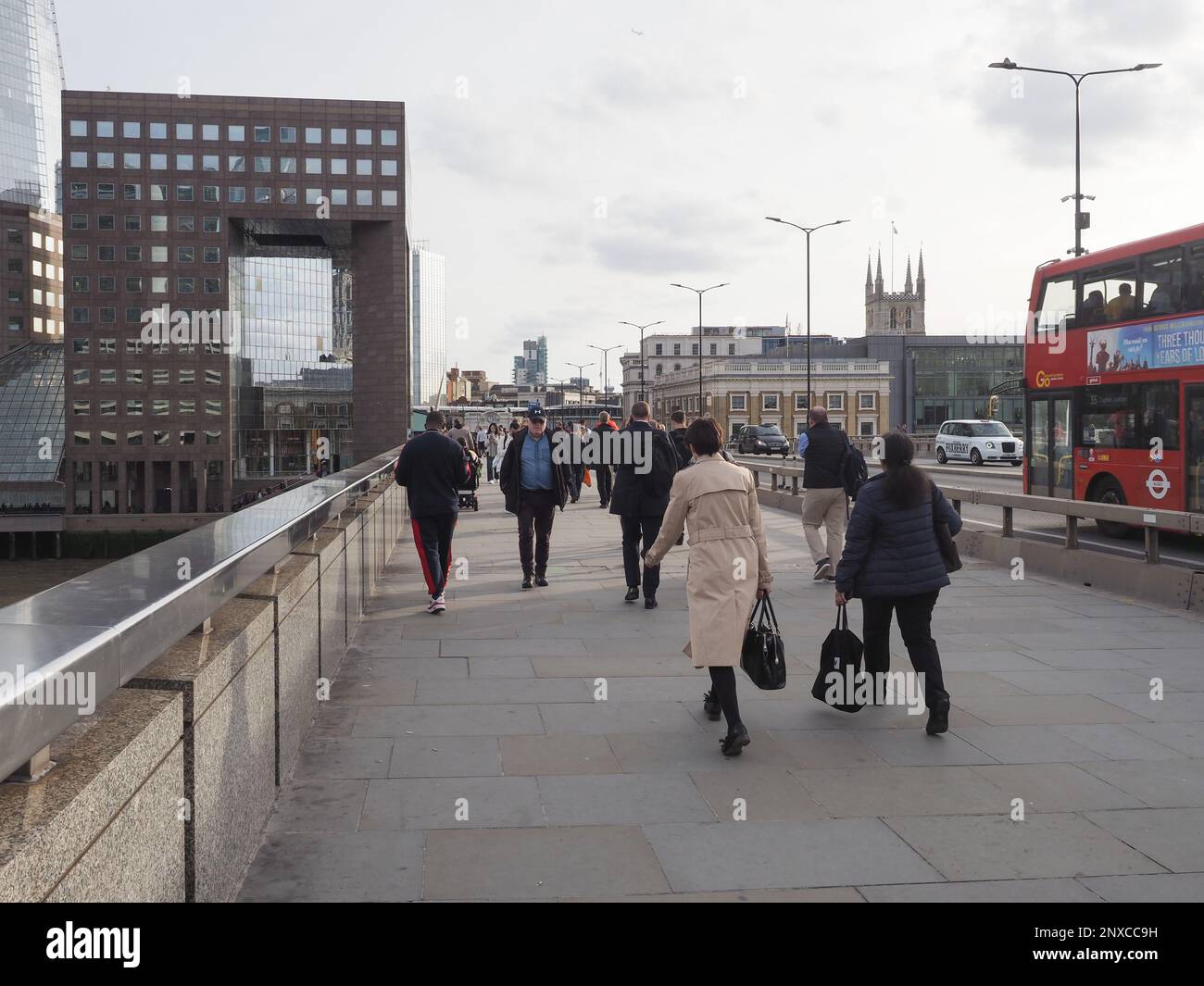 LONDON, UK - CIRCA OCTOBER 2022: People crossing London Bridge over ...