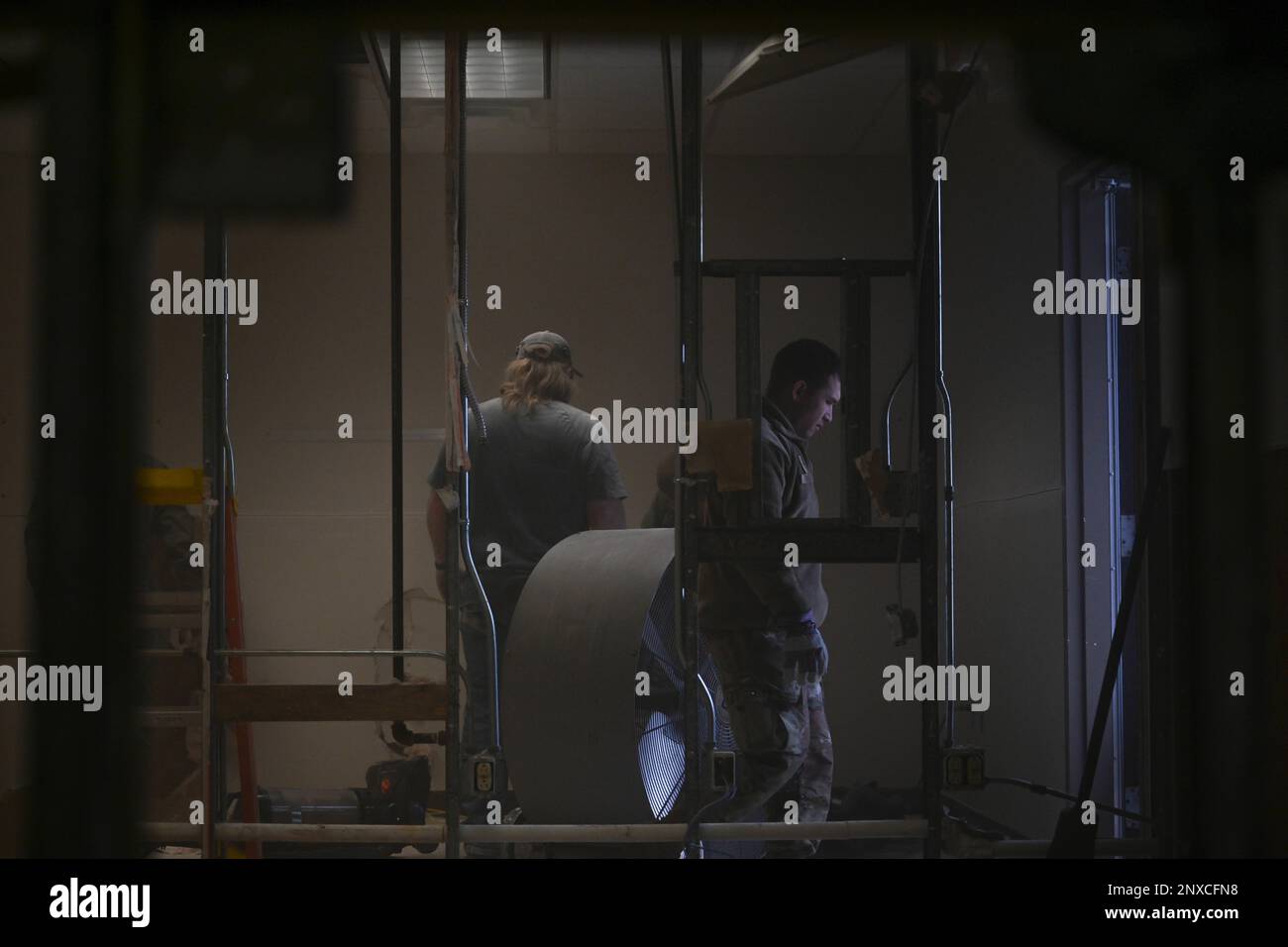 Team Little Rock Airmen remove drywall from a storm damaged building at ...