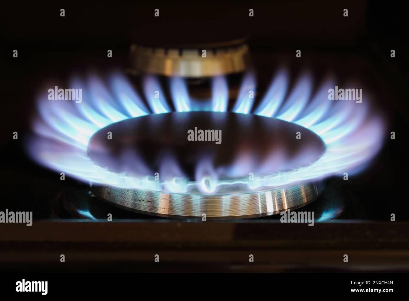 Abstract of a blue gas or propane flame of a kitchen cook stove in ...