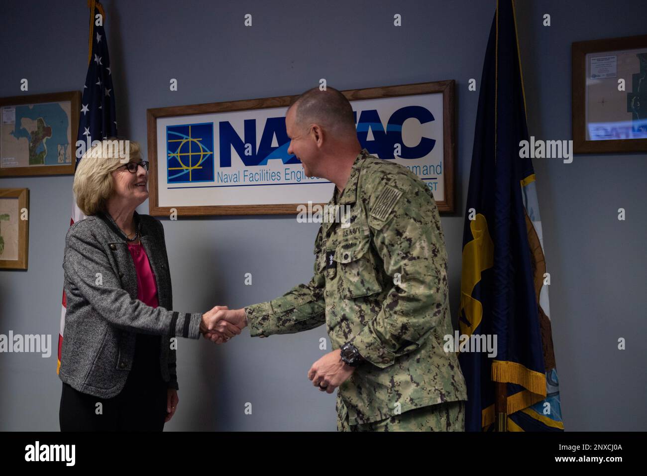 Rear Adm. Dean VanderLey, commander, Naval Facilities Engineering Systems Command presents coins ...