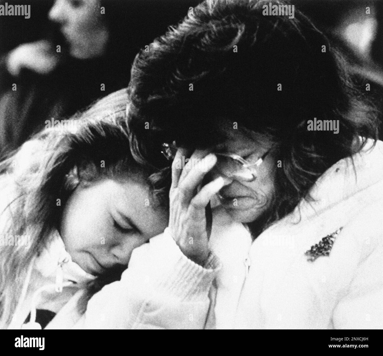 Penny and Barb Stewart, from Kirtland, shed tears at the memorial ...