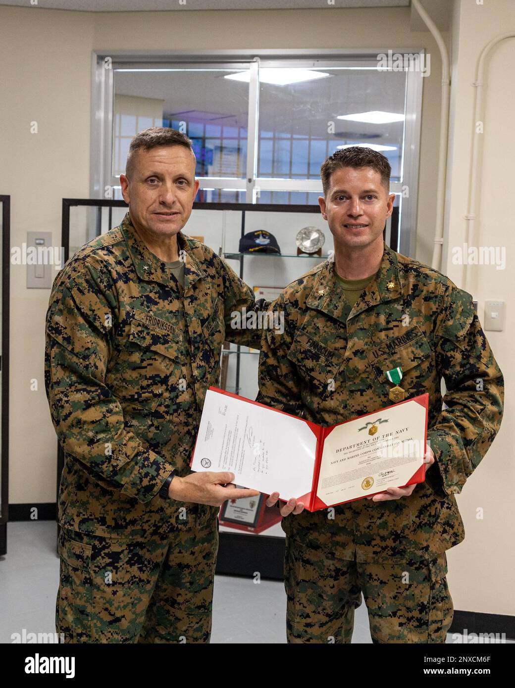 U.S. Marine Maj. Elvin Finnicum, plans officer, is awarded the Navy ...