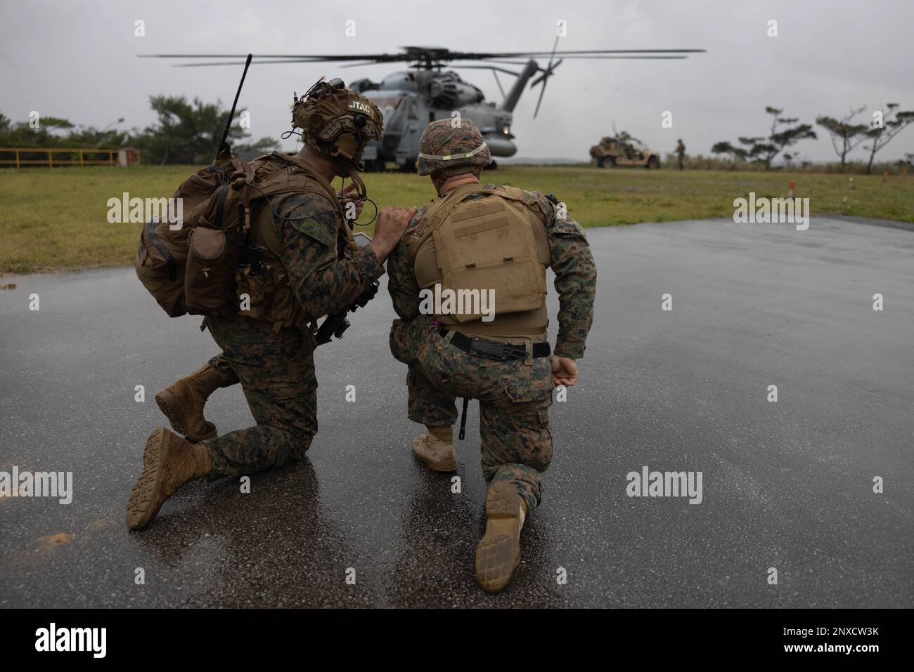 U.S. Marines with 3d Battalion, 4th Marines coordinate with CH-53E ...