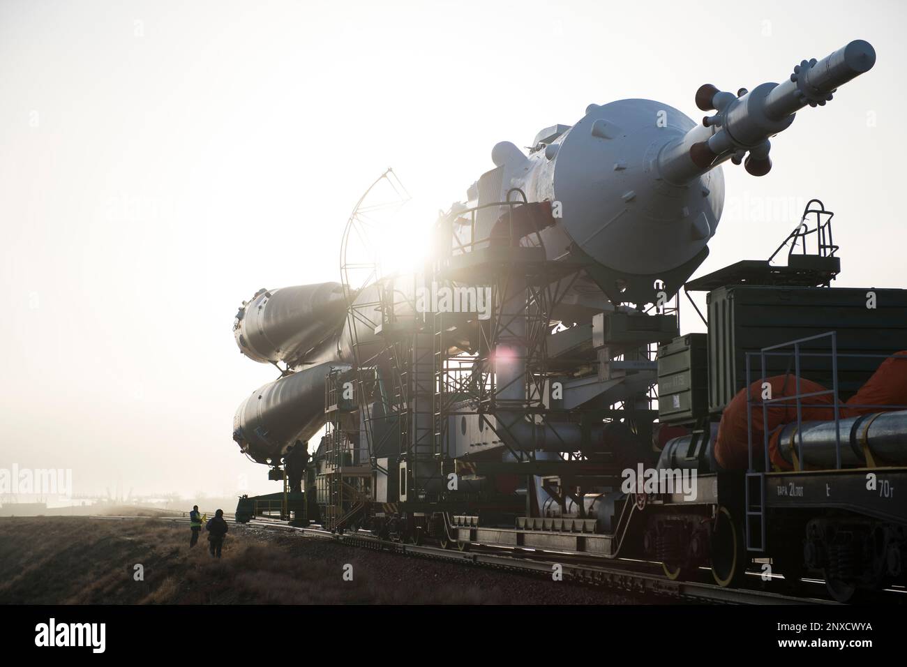 In this photo provided by NASA, the Soyuz rocket is rolled out by train ...