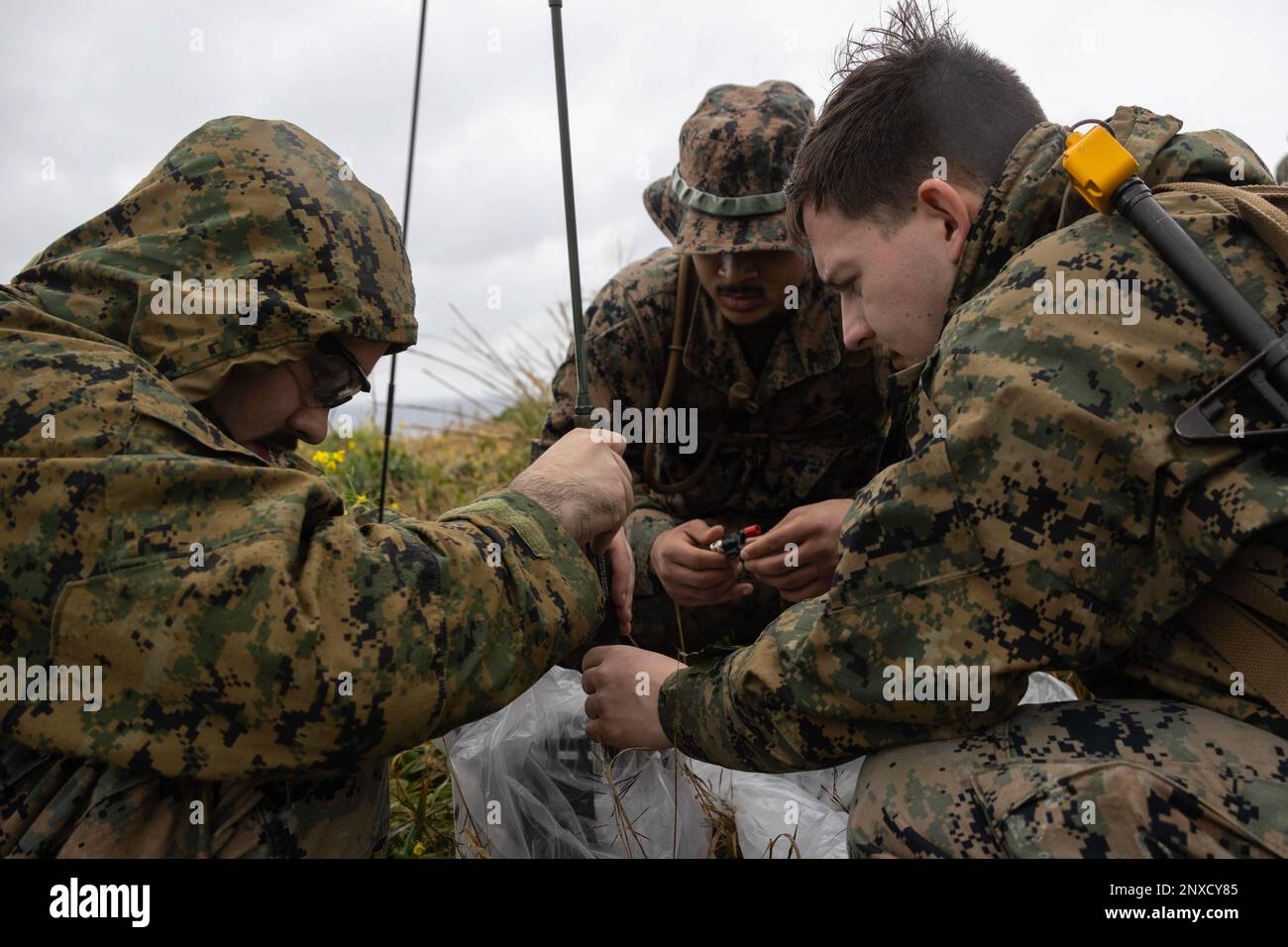 U.S. Marine Corps Cpl. Joshua Hall, left, Cpl. Trevon Thomas, middle ...