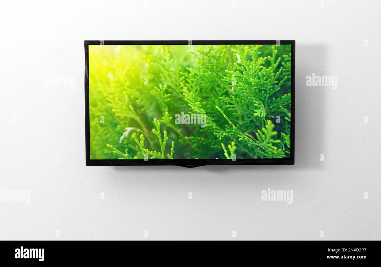 TV monitor on the wall Stock Photo - Alamy
