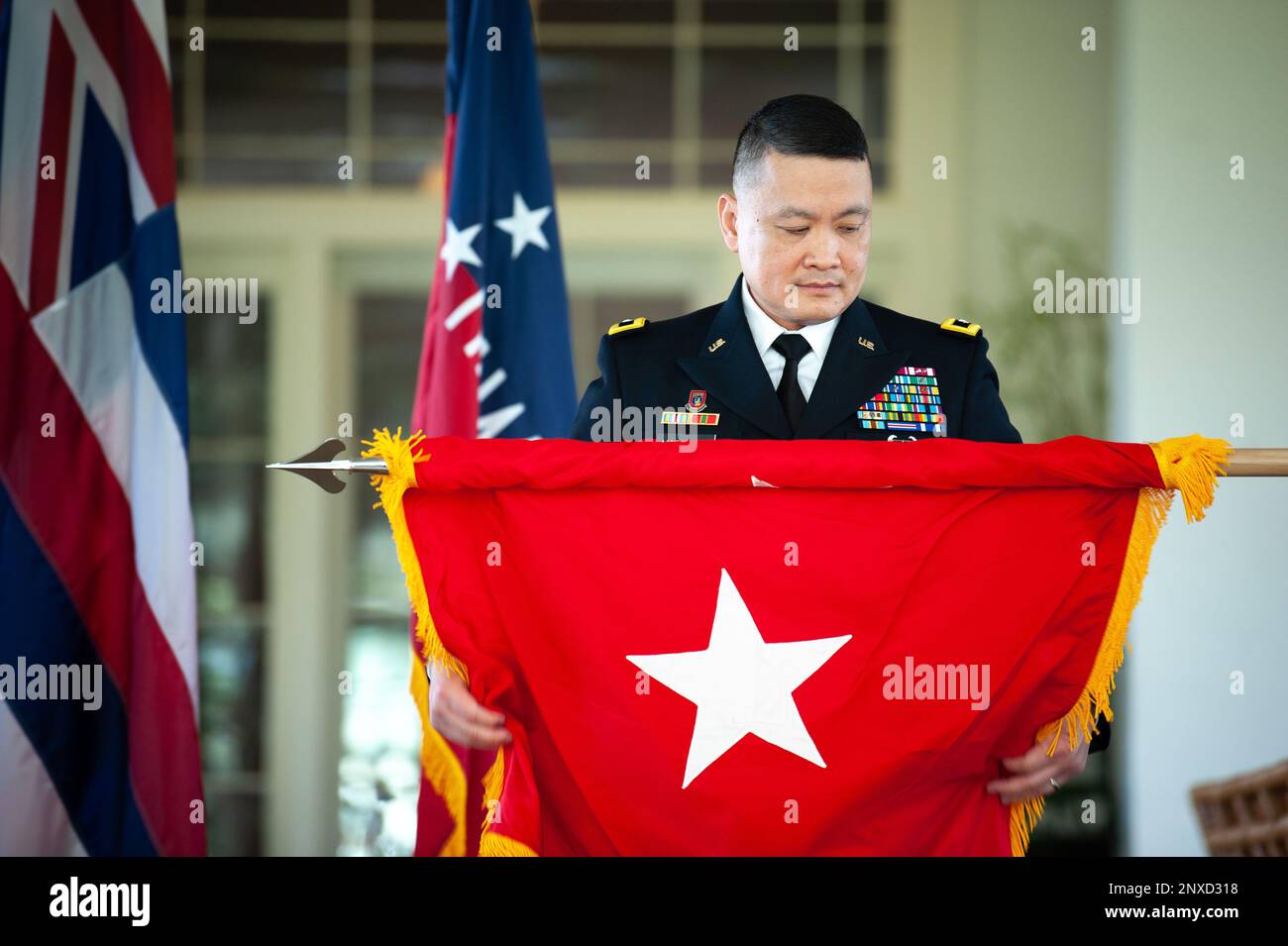 U.S. Army Maj. Gen. Roy Macaraeg unfurls his two-star flag during his ...