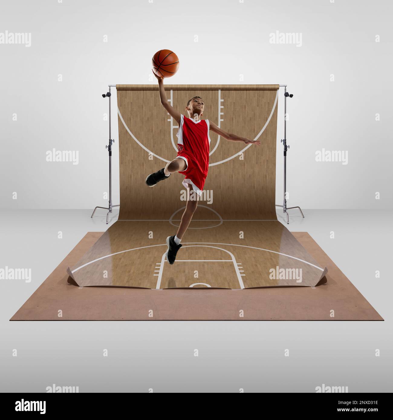 Slam dunk. Teen boy, professional basketball player in uniform ...