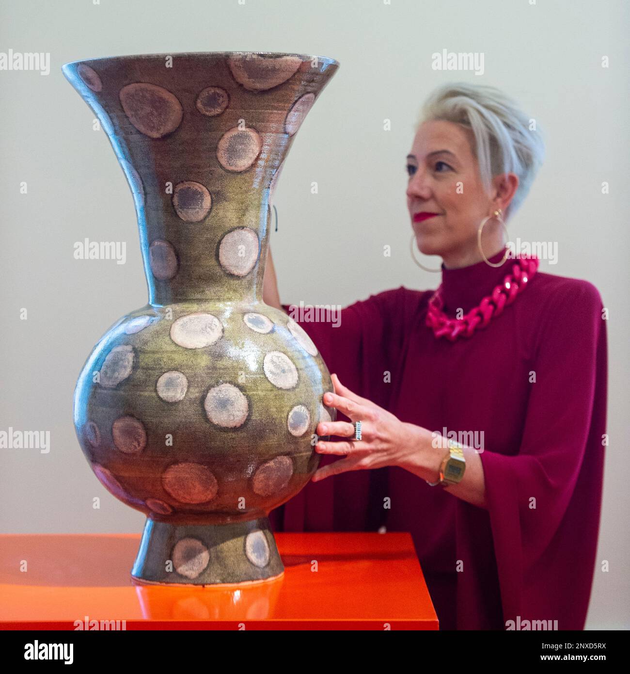 London, UK. 1 March 2023. A staff member presents a work by Martyn ...