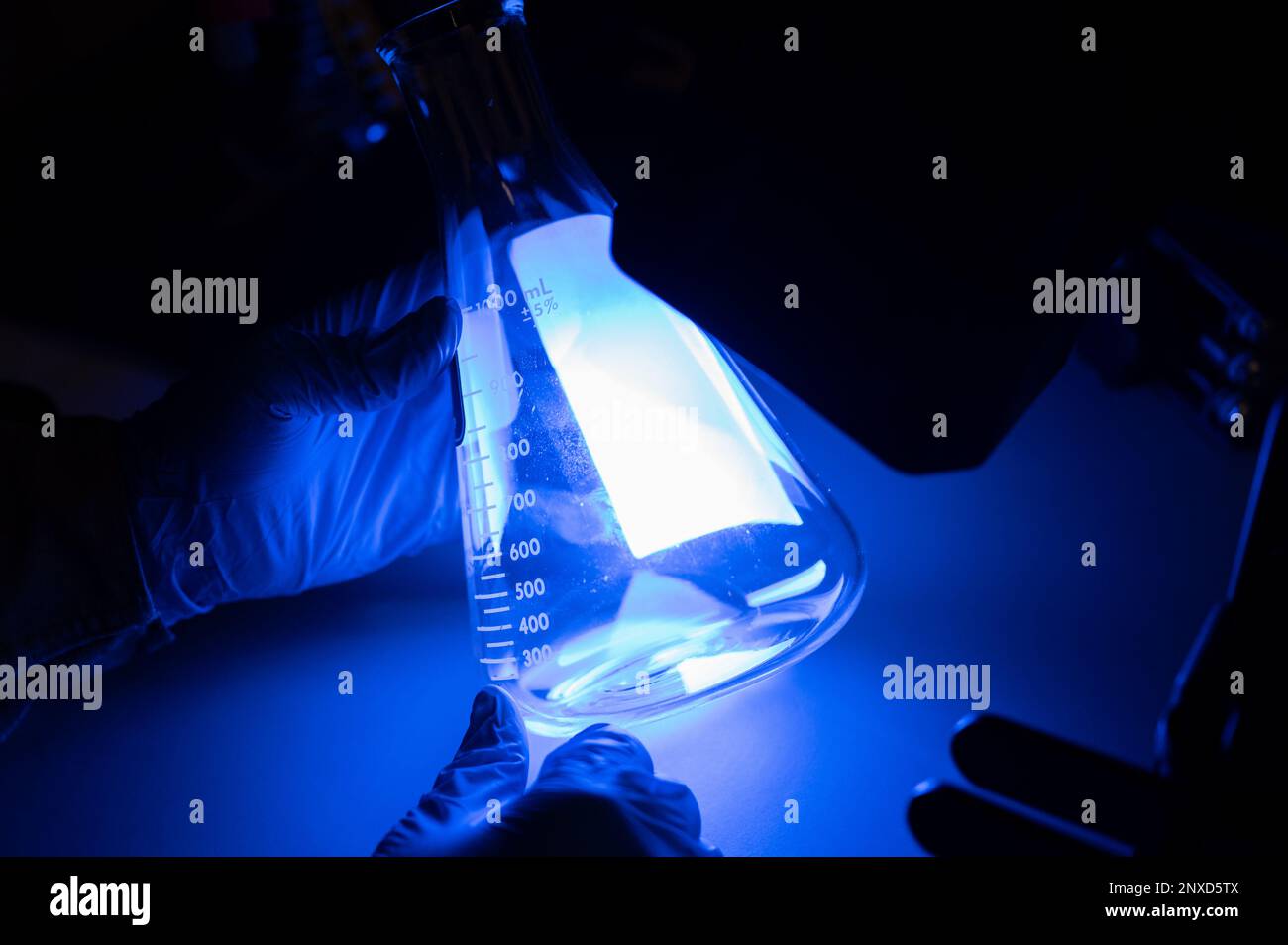 A beaker is set under a black light to check for oxygen contamination ...
