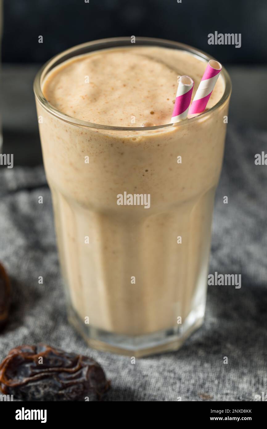 Homemade Sweet Date Milkshake with Ice Cream Stock Photo - Alamy