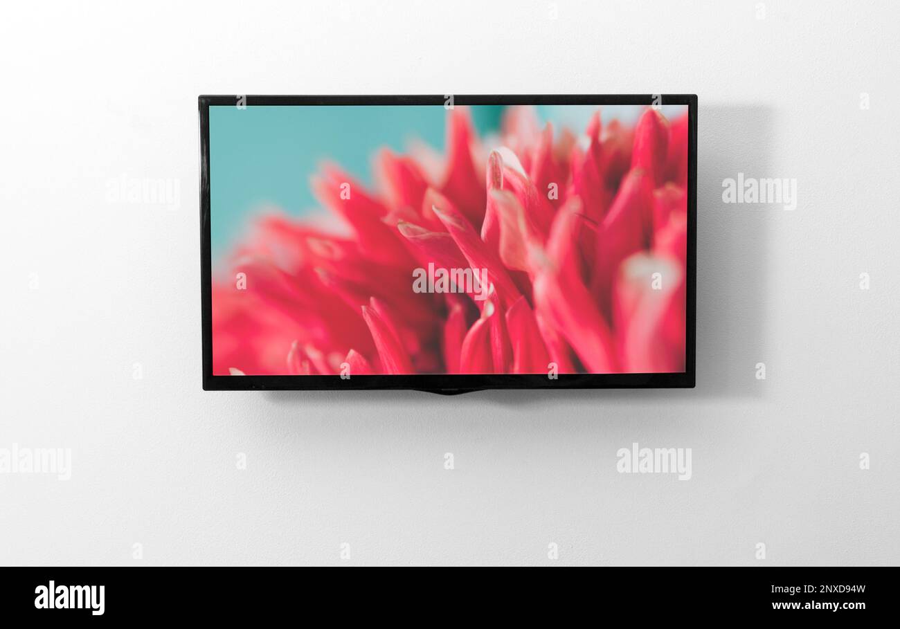 TV monitor on the wall Stock Photo - Alamy