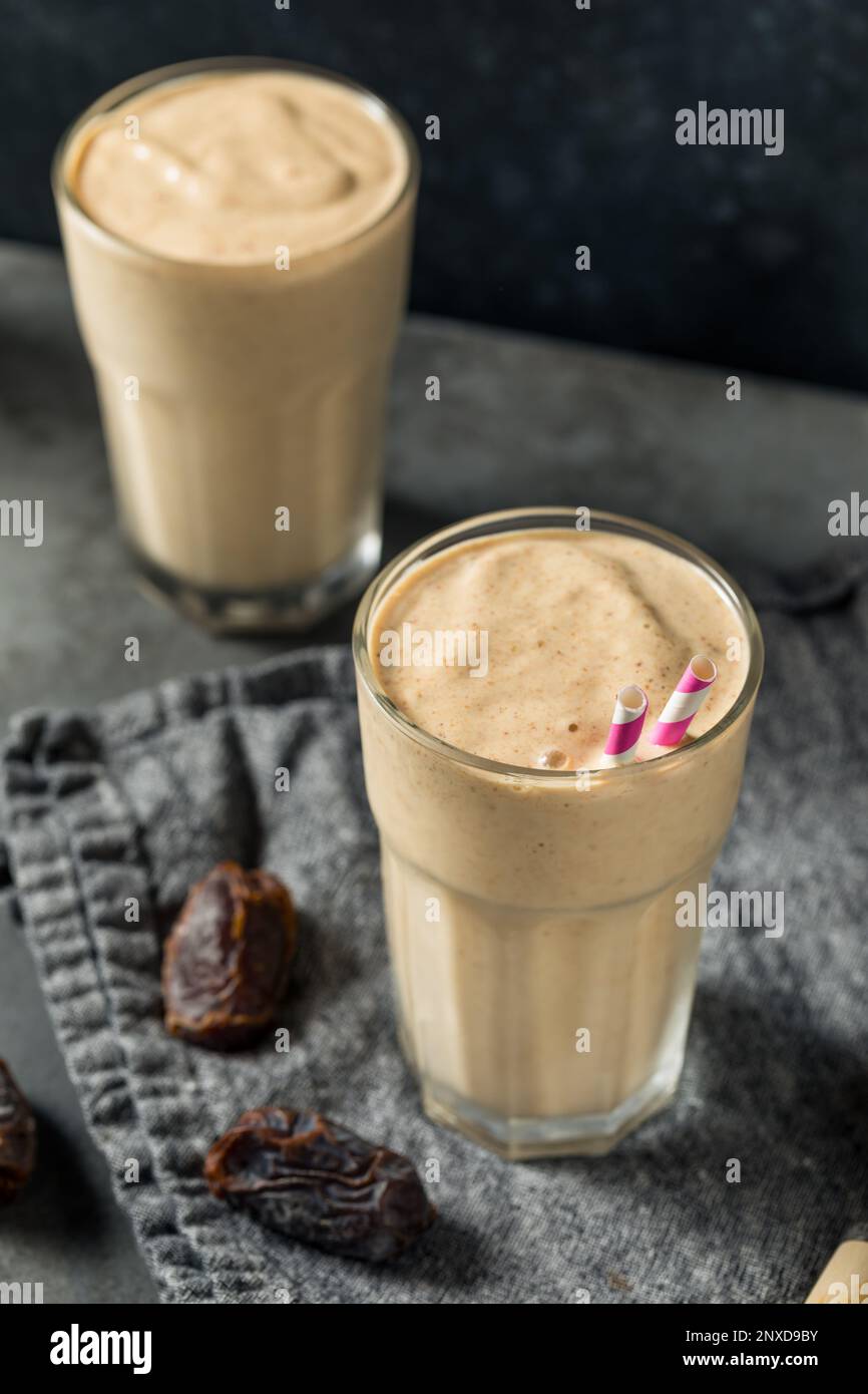 Homemade Sweet Date Milkshake with Ice Cream Stock Photo - Alamy