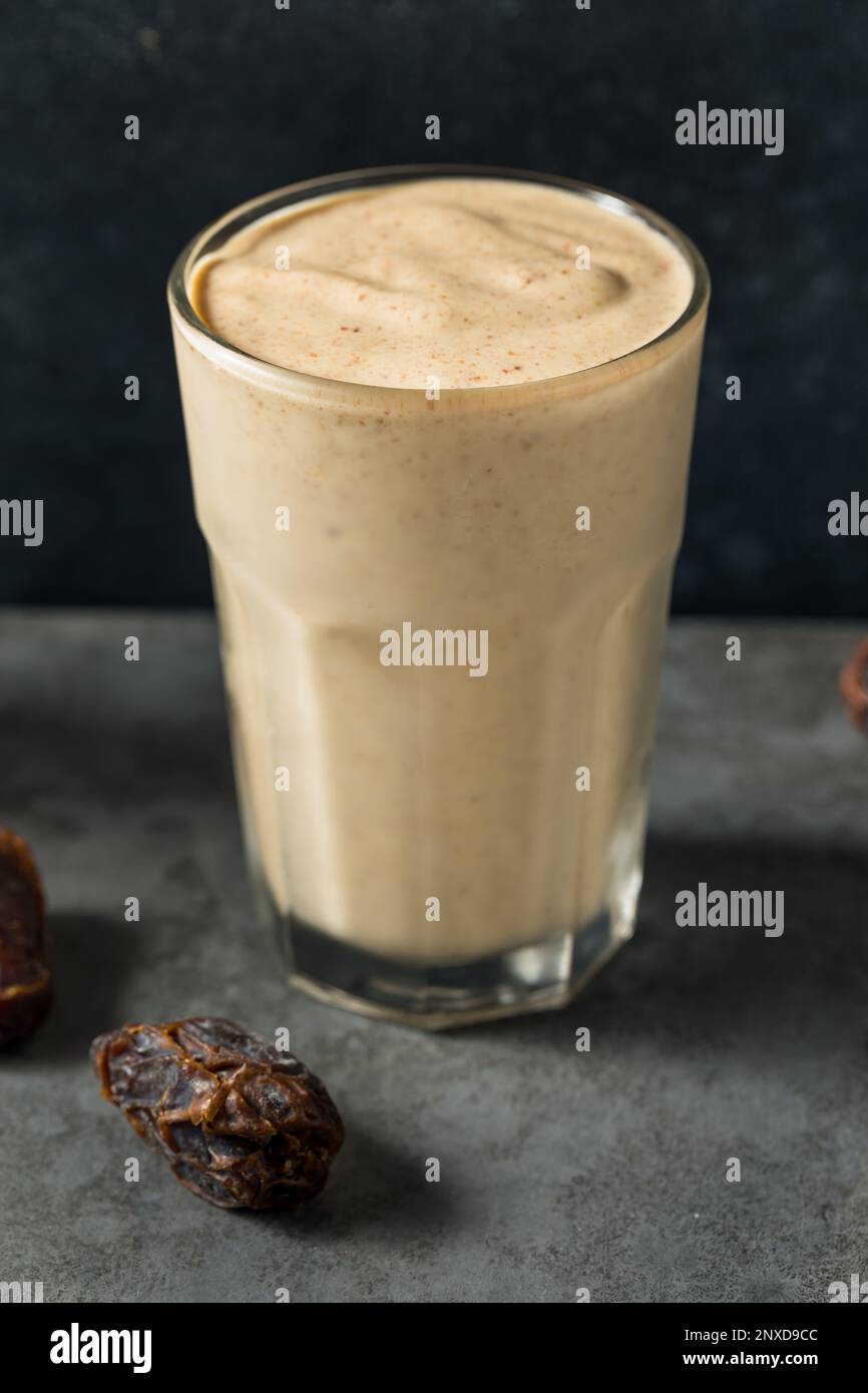 Homemade Sweet Date Milkshake with Ice Cream Stock Photo - Alamy