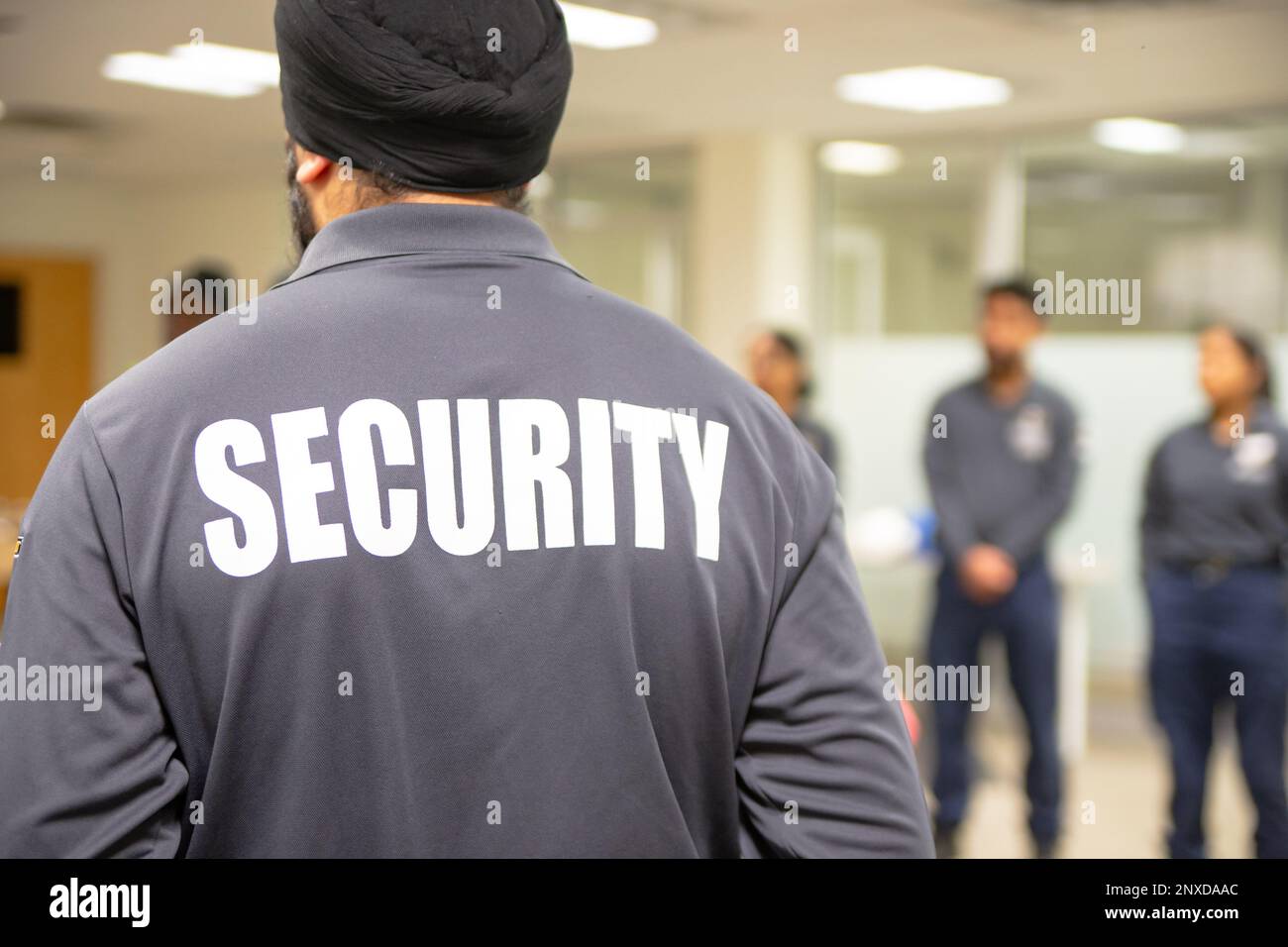 Fire Alarm training class by security guard in office Stock Photo - Alamy