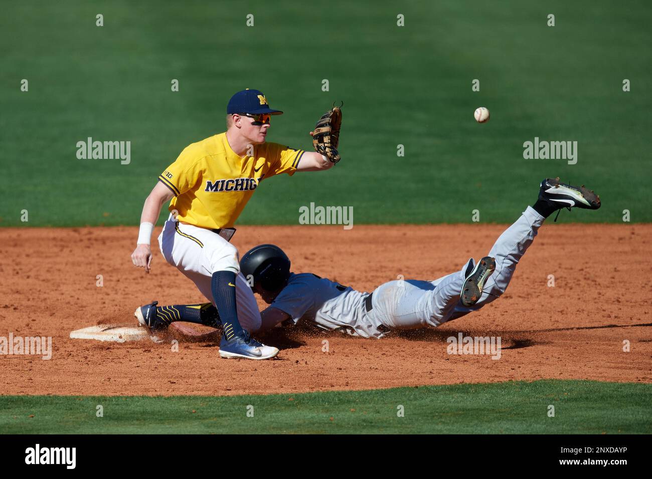 Michigan Wolverines shortstop Jack Blomgren (18) waits for a throw as ...