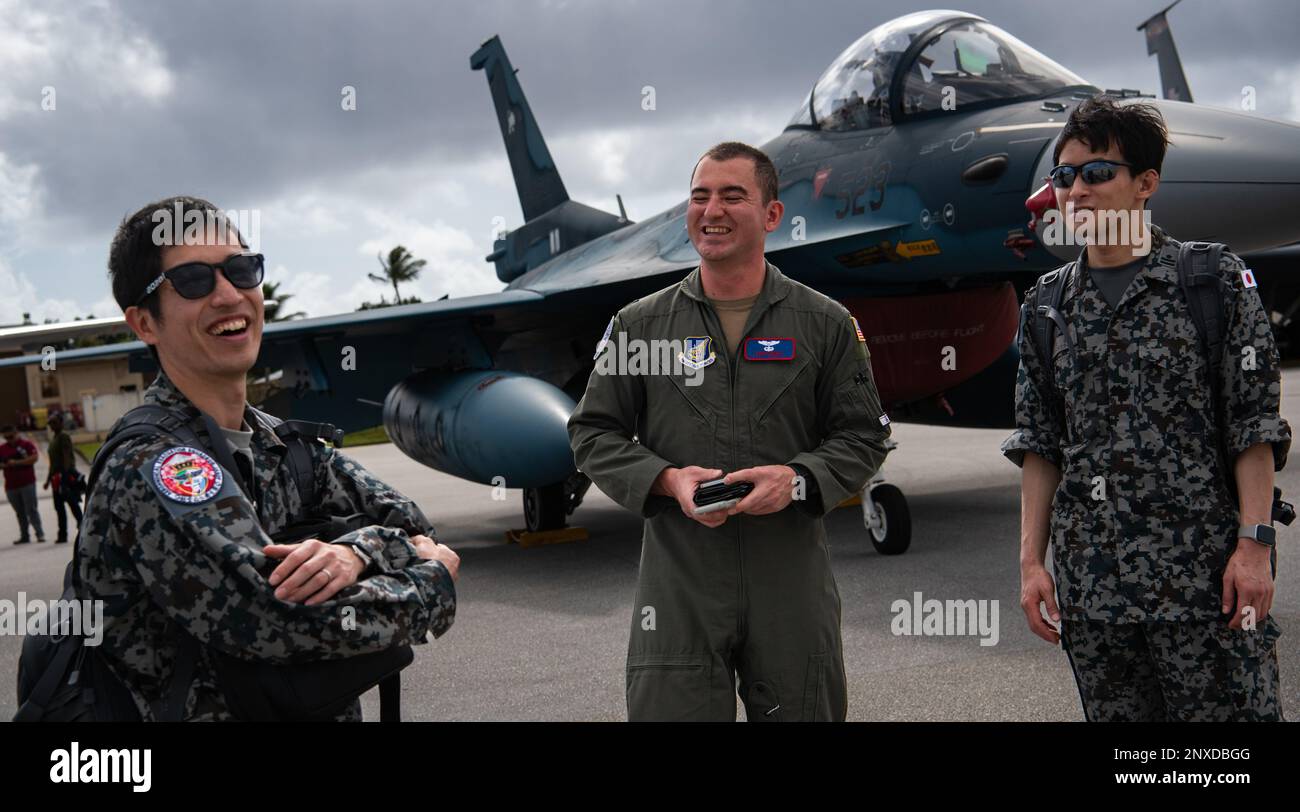Japan Air Self-Defense Force members and a U.S. Air Force pilot trade ...