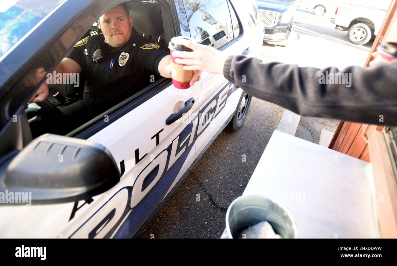Ault police officer Aaron Herrington stops for a morning coffee stop ...