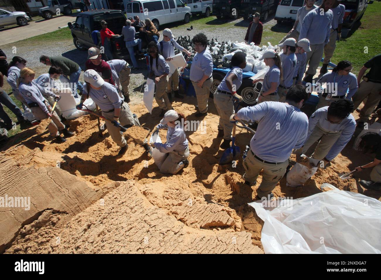 Members of AmeriCorps NCCC Southern Region assist in filling sandbags ...