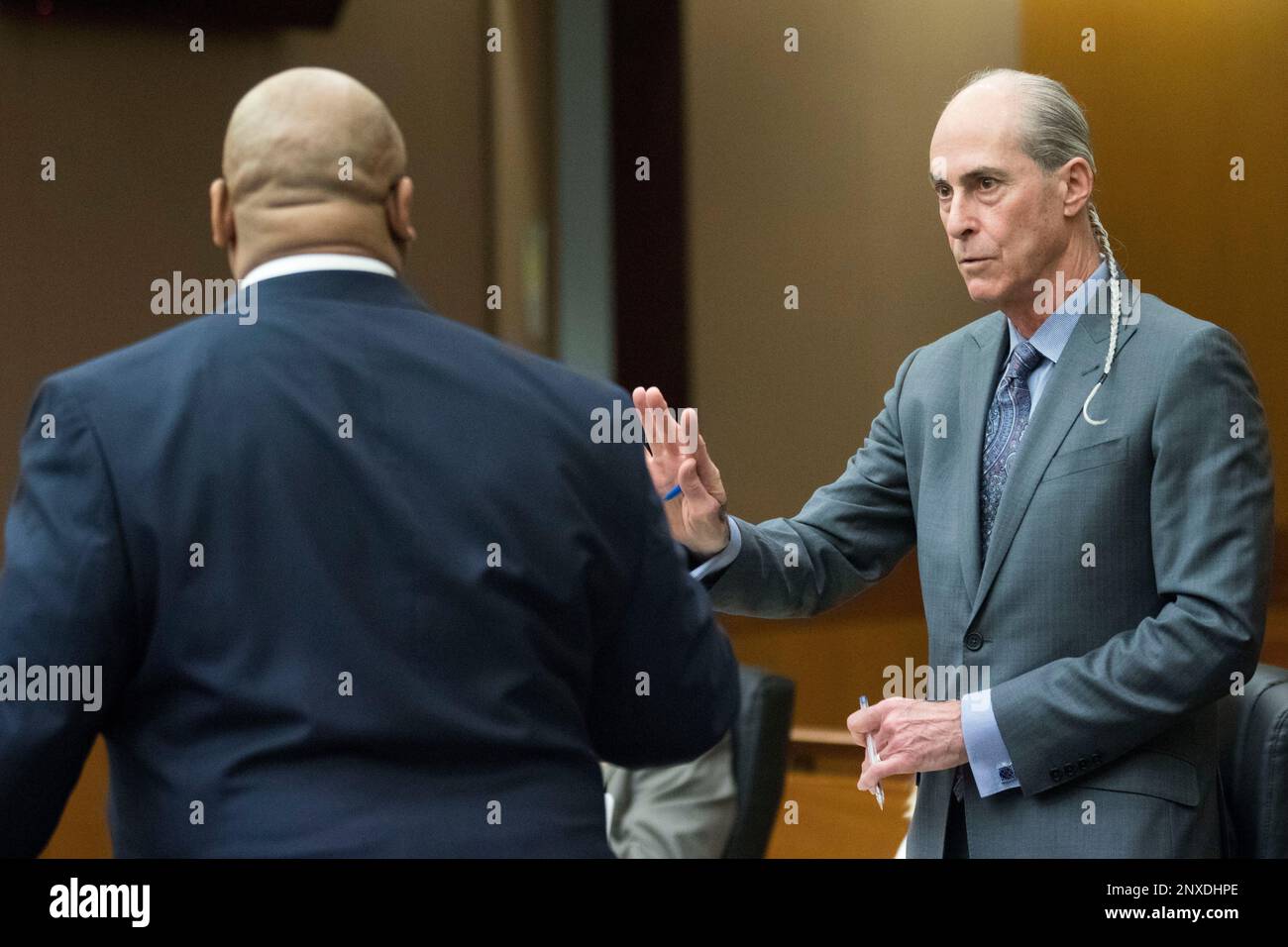 Defense attorney Bruce Harvey, right, objects to a question asked by ...