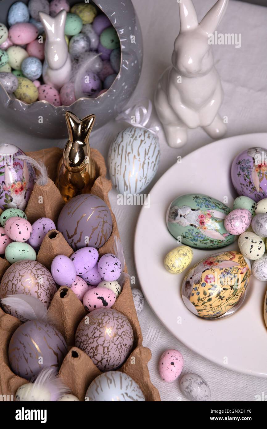 photo decorative eggs of different shapes and colors and a rabbit on ...
