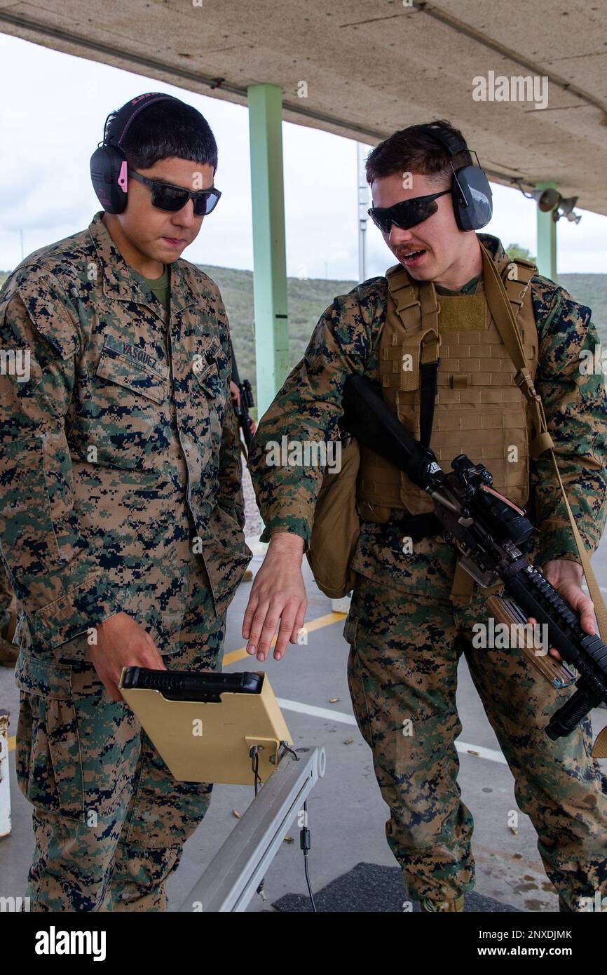 U.S. Marine Corps Lance Cpl. Aaron Vasquez instructs Lance Cpl. Anthony ...