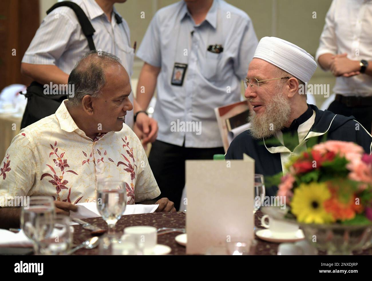 Home Affairs Minister K. Shanmugam speaking with Syrian Islamic scholar ...