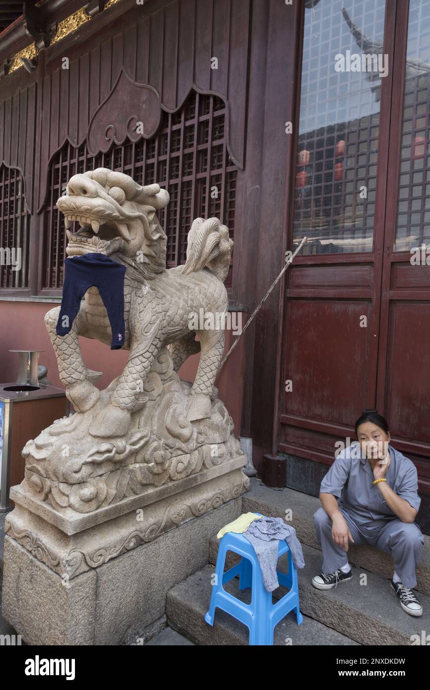 Woman drying laundry Stock Photo - Alamy