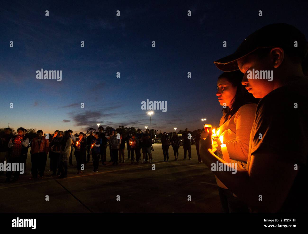 Ericka Rivera and her son Emilio, 12, listen during a prayer vigil in ...