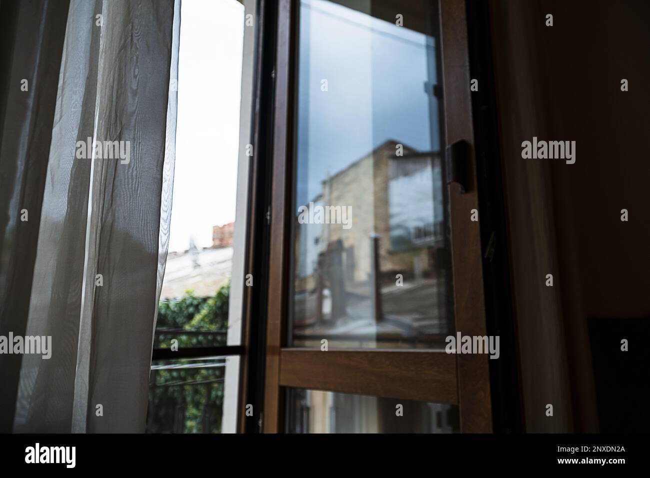 Open window in the bedroom with daylight and curtains Stock Photo - Alamy