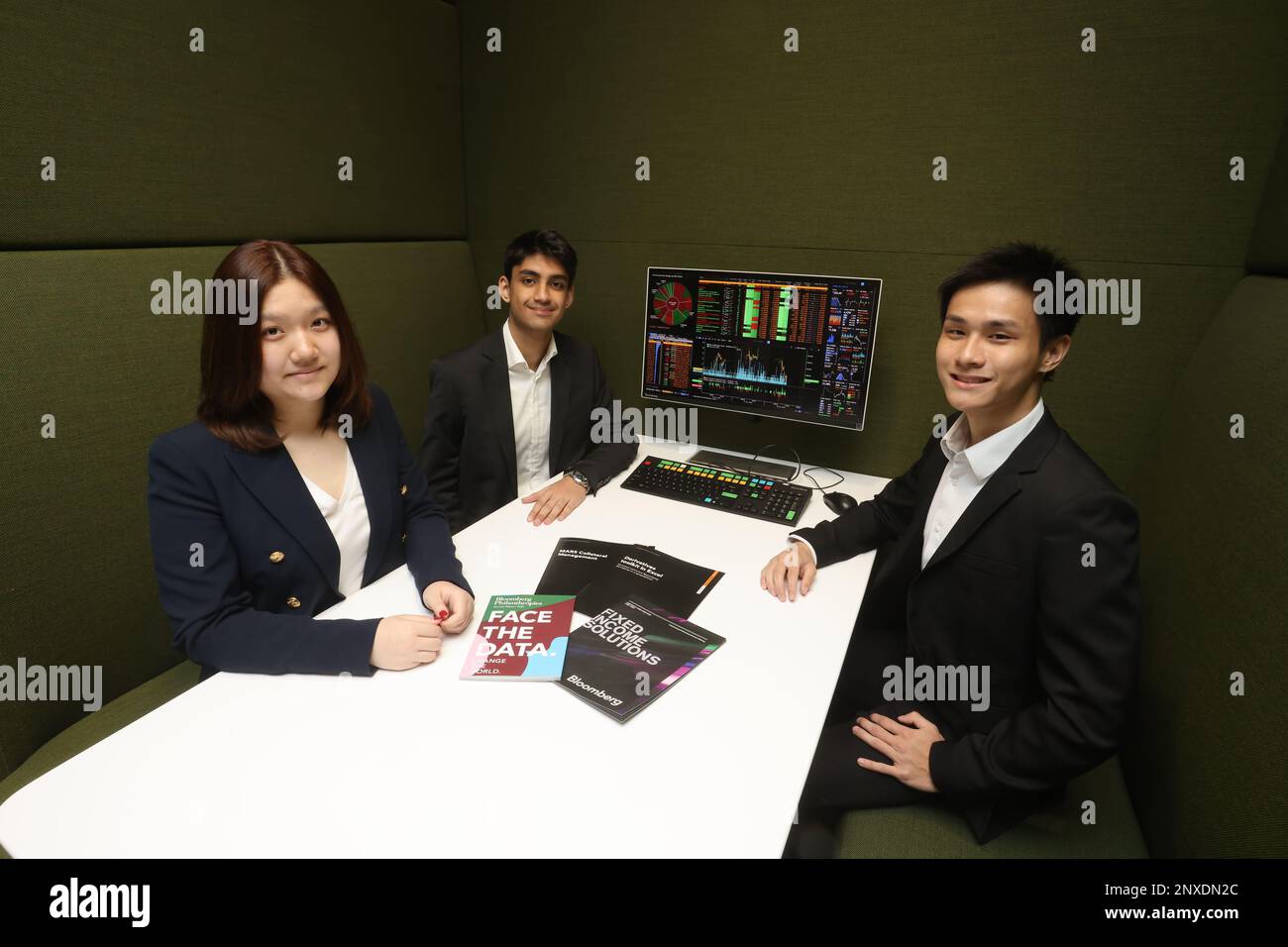 (L to R) Germaine So, Tanush Changani, and Victor Fong, students from ...
