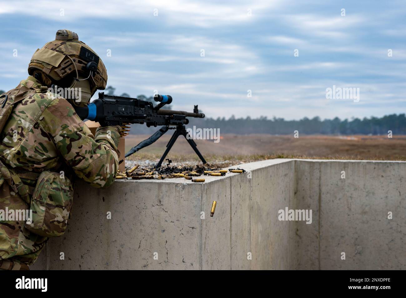 A 304th Rescue Squadron pararescueman fires an M240 machine gun ...