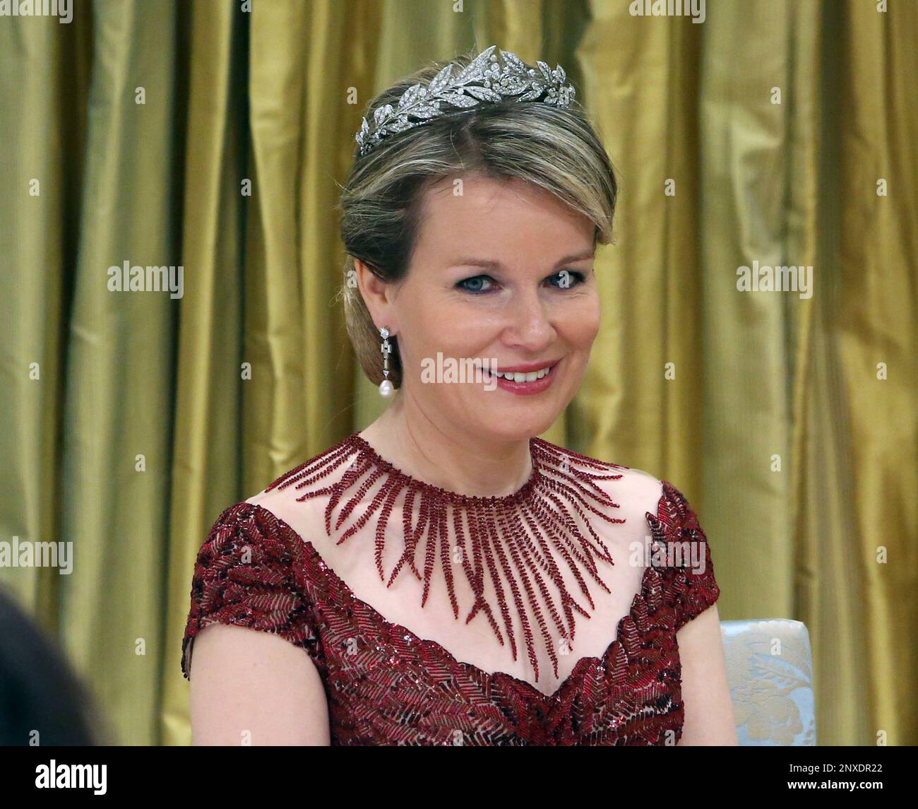 Queen Mathilde of Belgium smiles as she takes part in a state dinner in at Rideau Hall, the ...