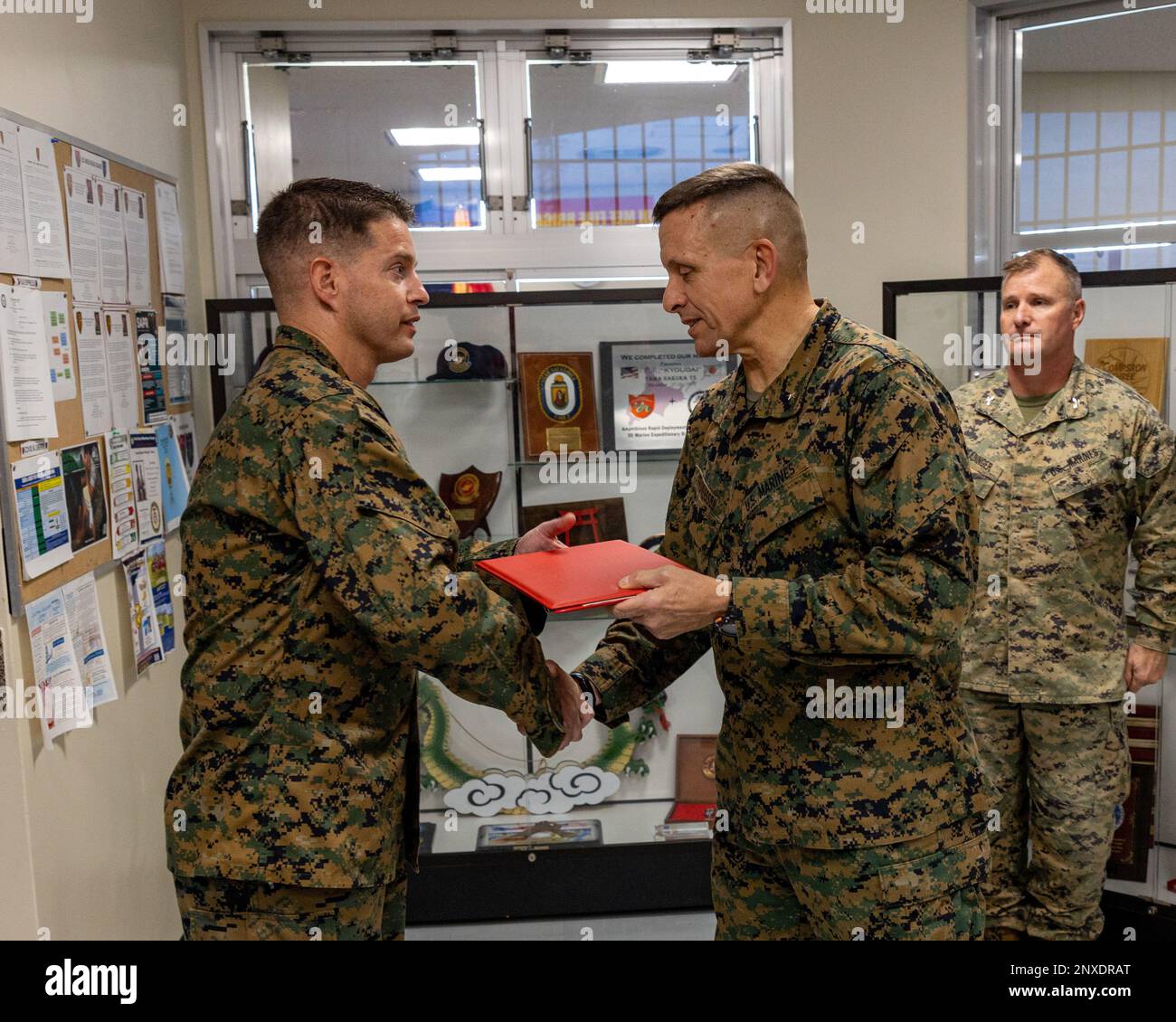 U.S. Marine Maj. Elvin Finnicum, plans officer, is awarded the Navy ...