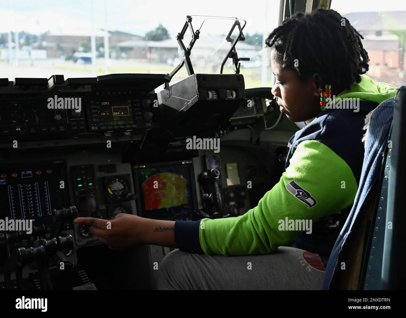 A student from Stafford Elementary School, Tacoma, explores the cockpit ...