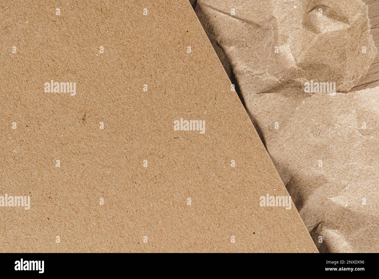 Crumpled craft paper with carton sheets close up Stock Photo - Alamy