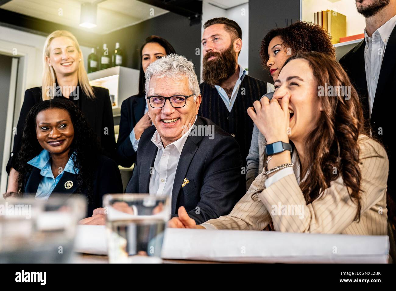 Multiethnic joyful business people during a fun business meeting they ...