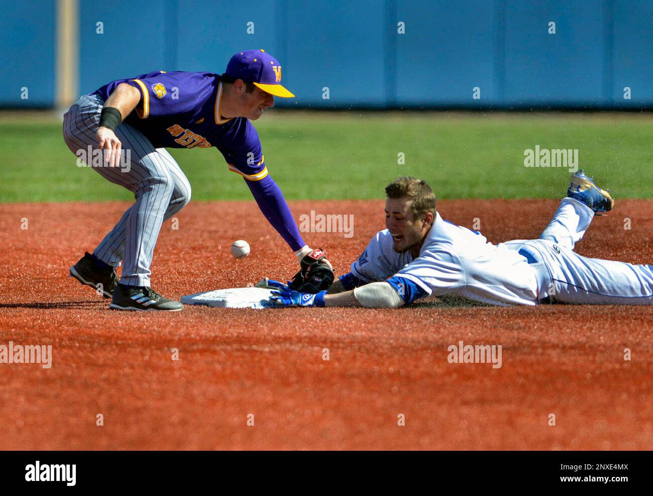 Western Illinois shortstop Johnathan Fleek, left, can't keep the ball ...