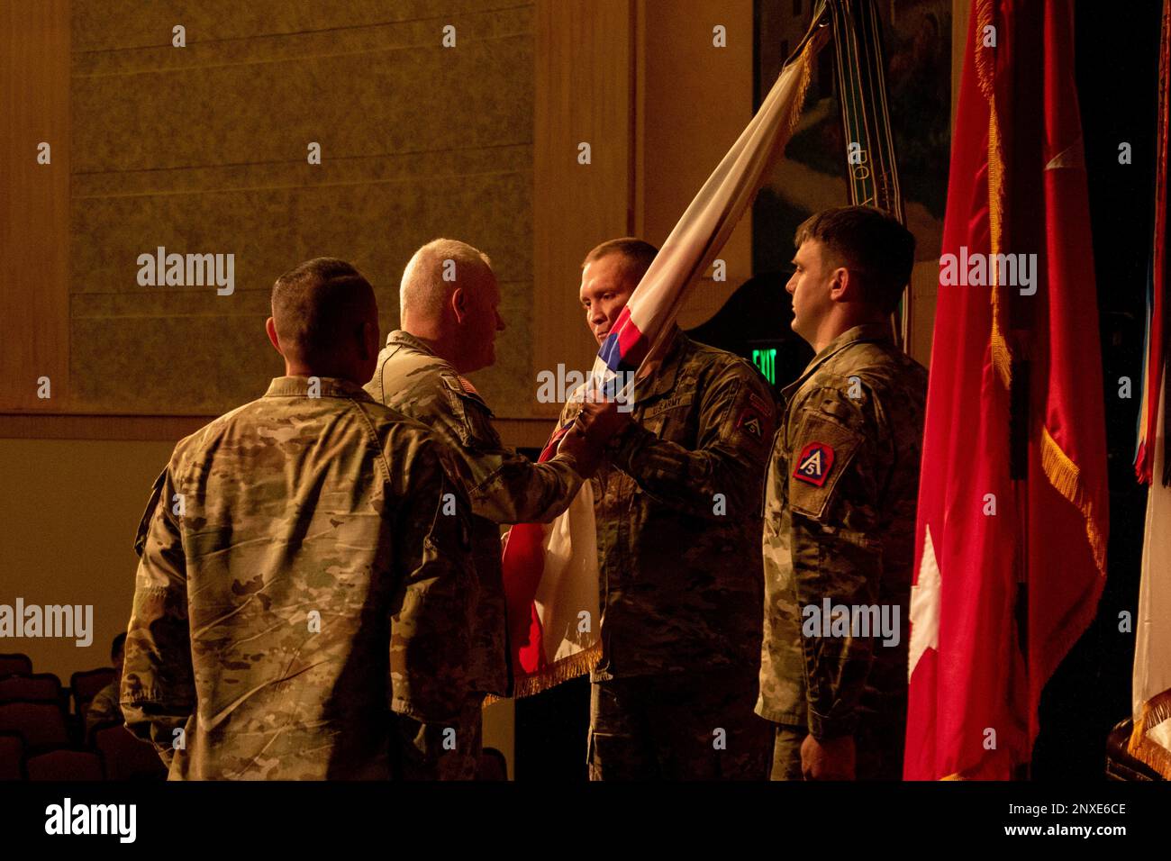 U.S. Army Lt. Gen. John R. Evans, Army North commanding general, passes the unit guideon to ...
