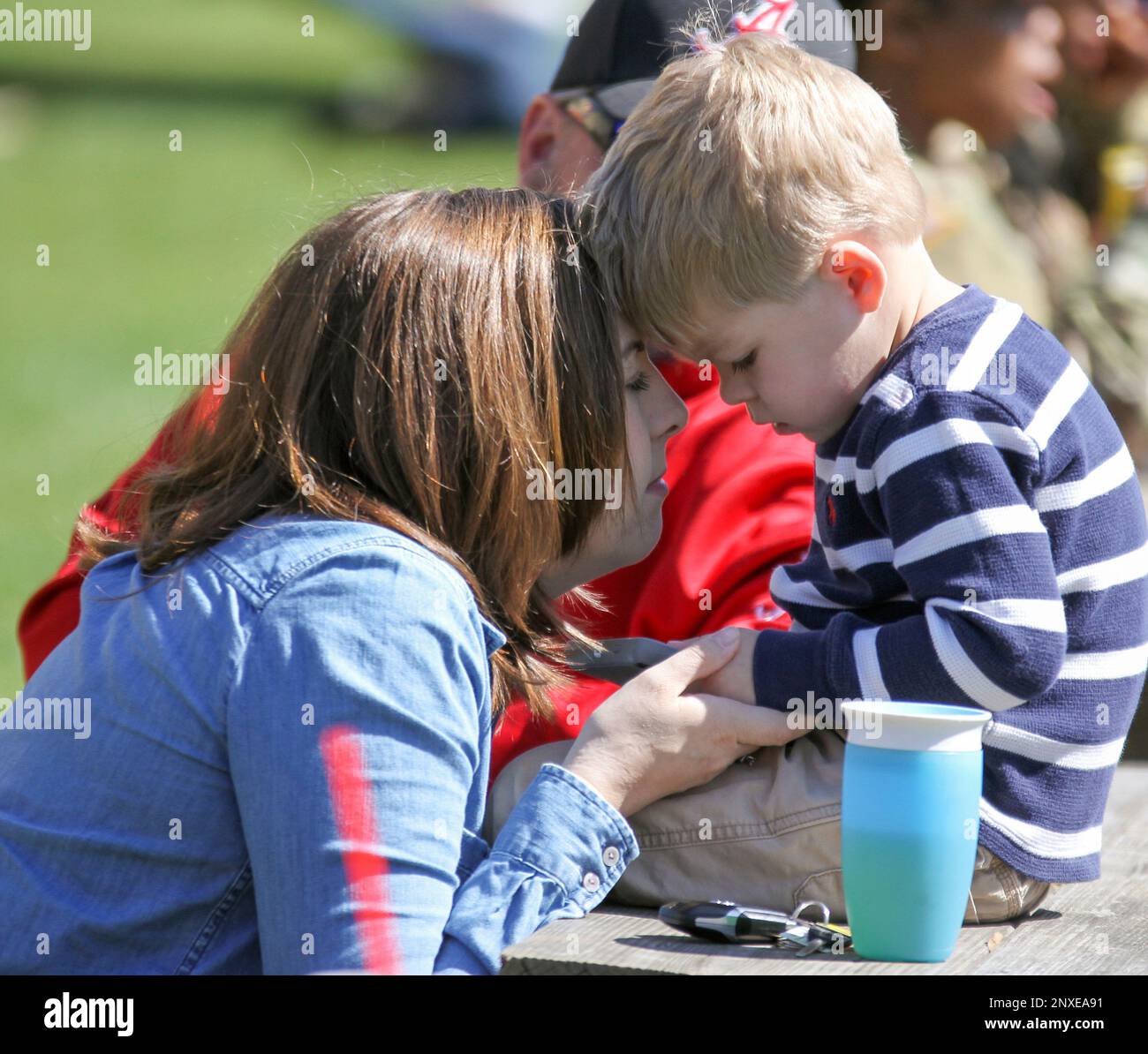 Rachelle Madison holds her head against her son Dade's as the two spend ...