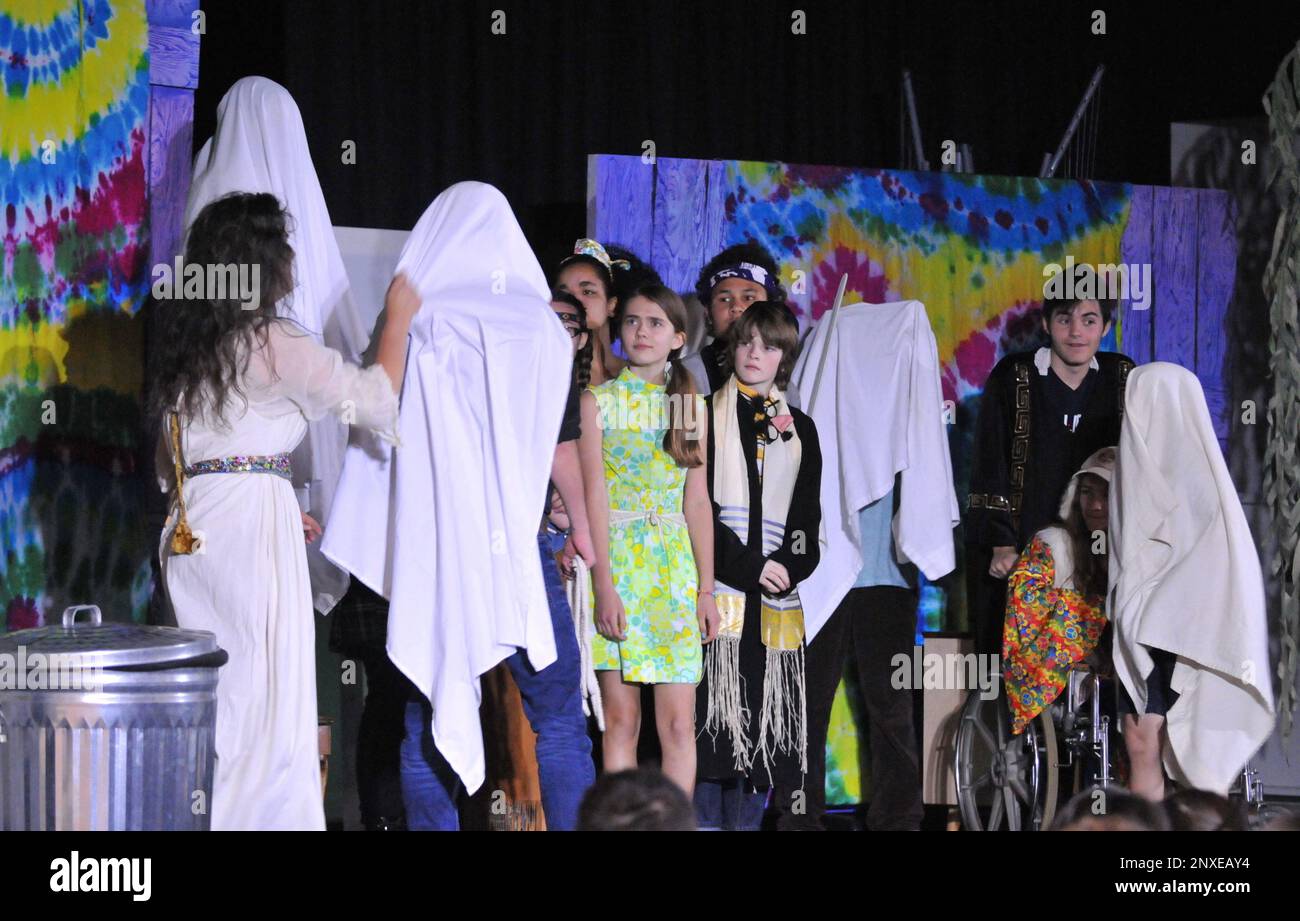 Actors shrouded in sheets resemble a Ku Klux Klan mob during Wednesday ...