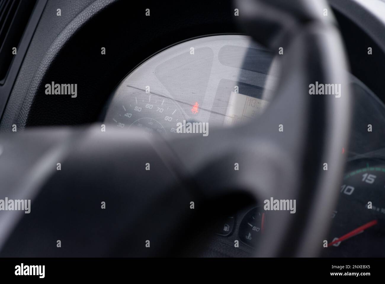Unfasten seat belt symbol warning lit on display of a heavy truck ...