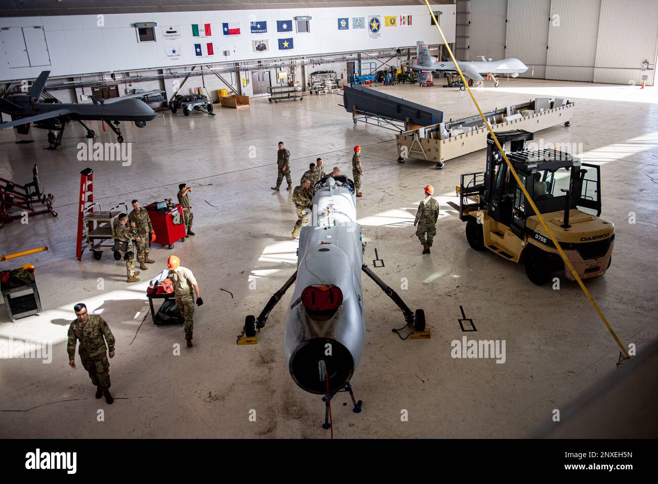 Members of the 147th Aircraft Maintenance Squadron assemble an MQ-9 ...