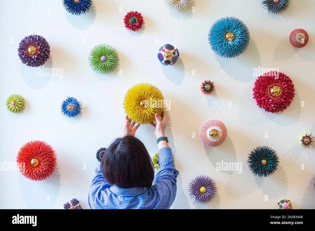 London, UK. 1 March 2023. A staff member presents works from the "Eye ...