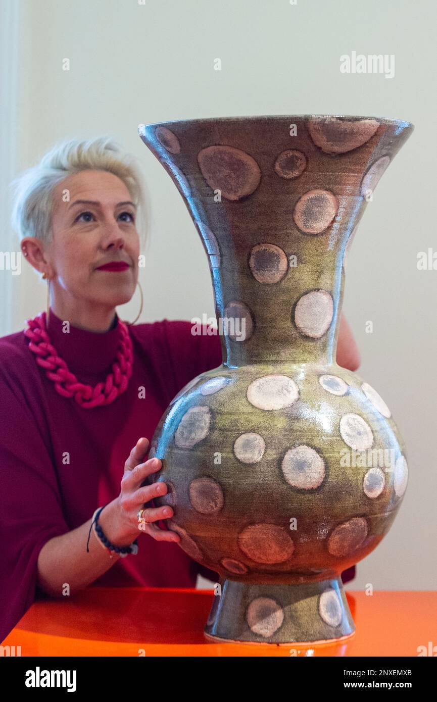 London, UK. 1 March 2023. A staff member presents a work by Martyn ...