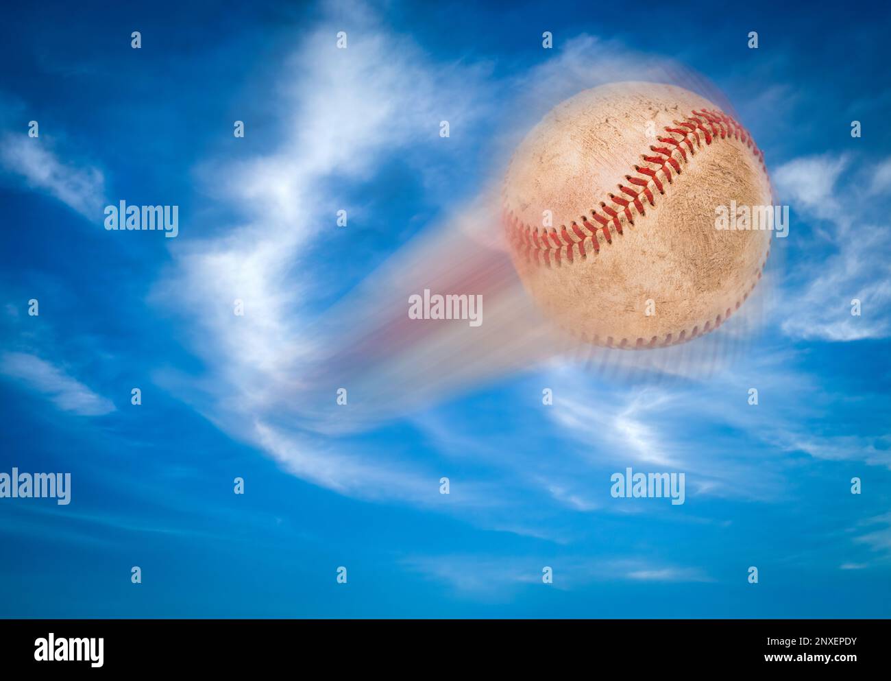 Baseball Flying Through The Air and Blue Sky Stock Photo - Alamy