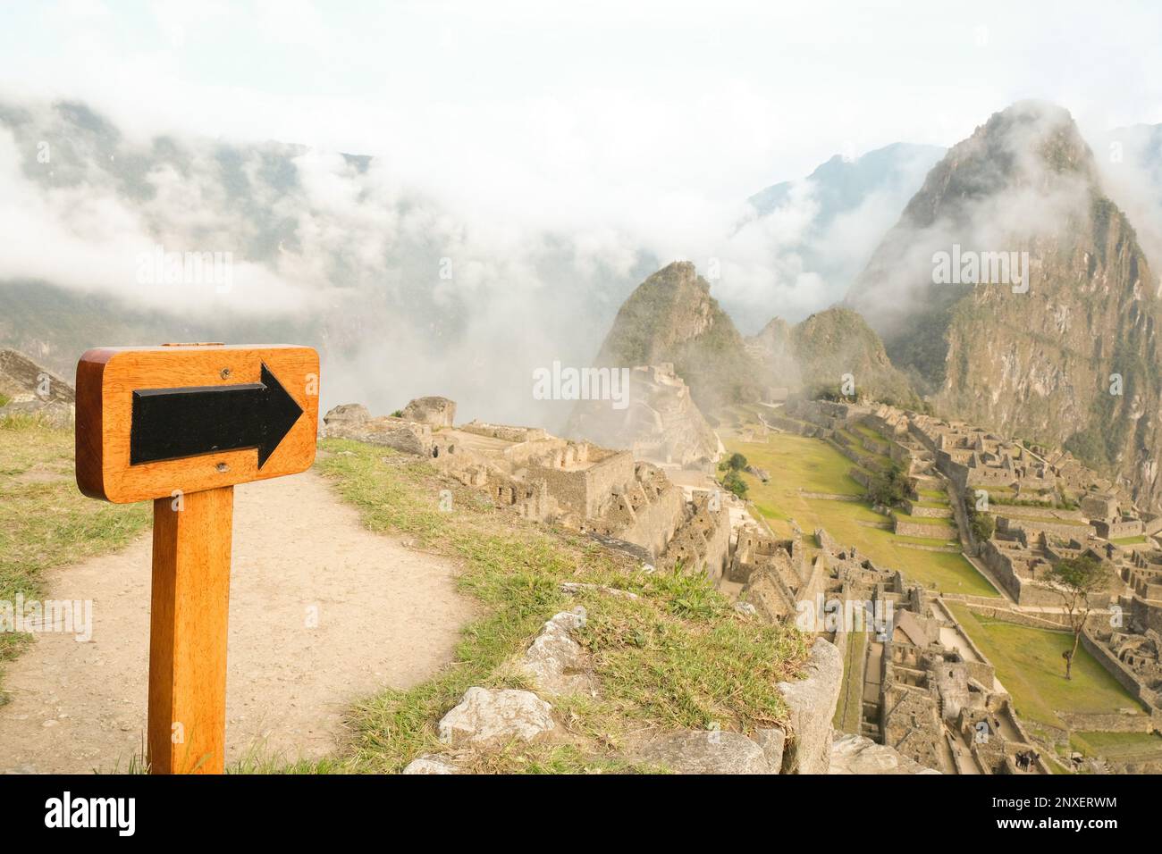 View of the Lost Incan City of Machu Picchu under foggy sky in Cusco ...